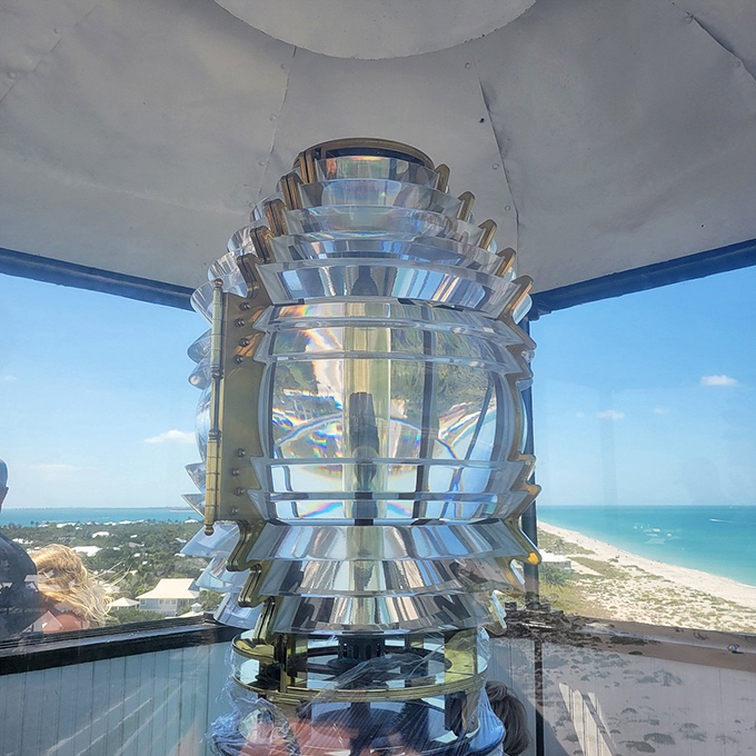 Engineering marvel meets artistic beauty. This Fresnel lens doesn't just guide ships&mdash;it transforms sunlight into a kaleidoscope of colors that dance across the lighthouse interior.