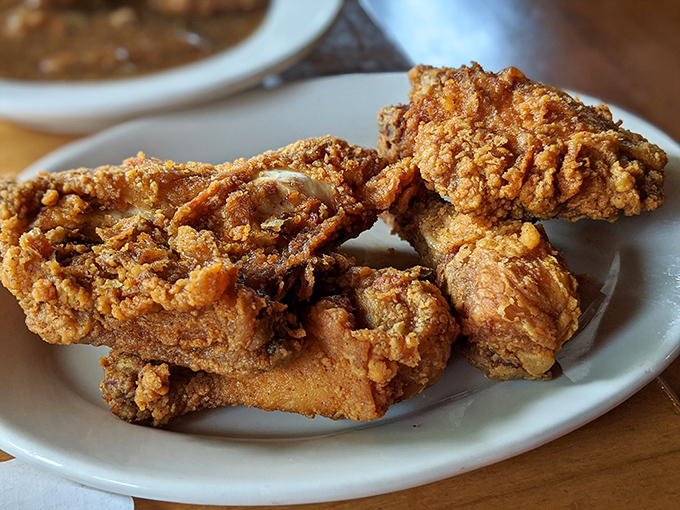 Golden-brown perfection that makes you understand why people drive for hours just for a bite&mdash;fried chicken that should have its own theme song.