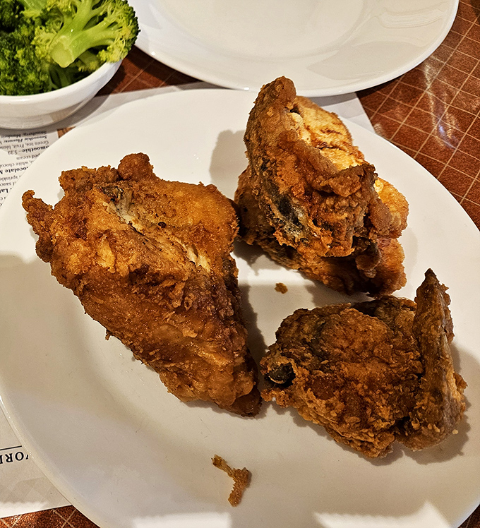 Golden-brown perfection that makes Colonel Sanders weep with envy. This famous fried chicken delivers that magical crunch-to-juicy ratio that dreams are made of.