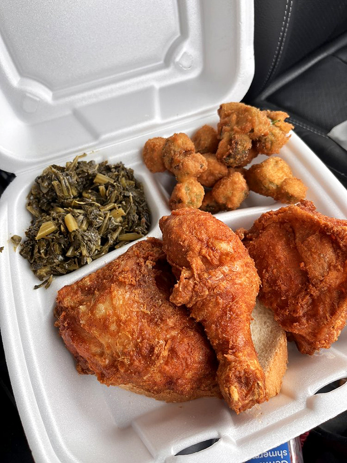 This isn't just takeout; it's edible treasure. That glistening crust protecting juicy meat alongside collard greens is Southern poetry on a styrofoam plate.