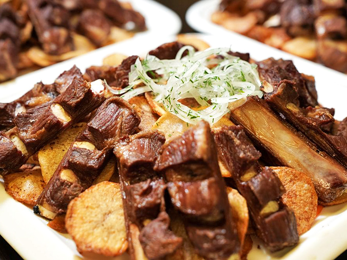 These lamb ribs aren't just falling off the bone&mdash;they're practically jumping onto your fork. Served over crispy potatoes, it's comfort food elevated to art.