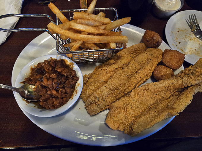 Golden-fried catfish that's crunchy on the outside, tender within. Paired with those crispy fries and baked beans, it's the Midwest on a plate.