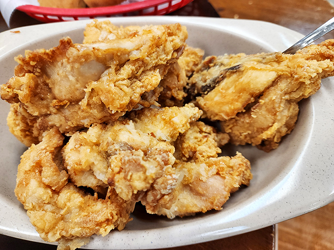 Golden-brown pieces of fried chicken with a crust so crispy you can practically hear the crunch through the photo. Southern cooking doesn't get more iconic than this.