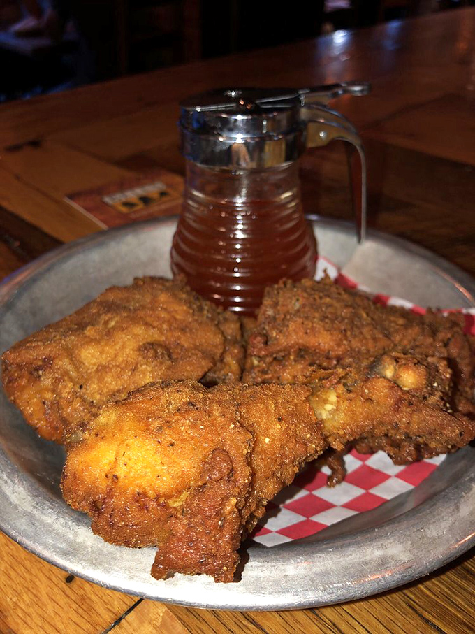 Golden-brown perfection with that spicy honey on standby. This isn't just fried chicken; it's a religious experience with a crunch.