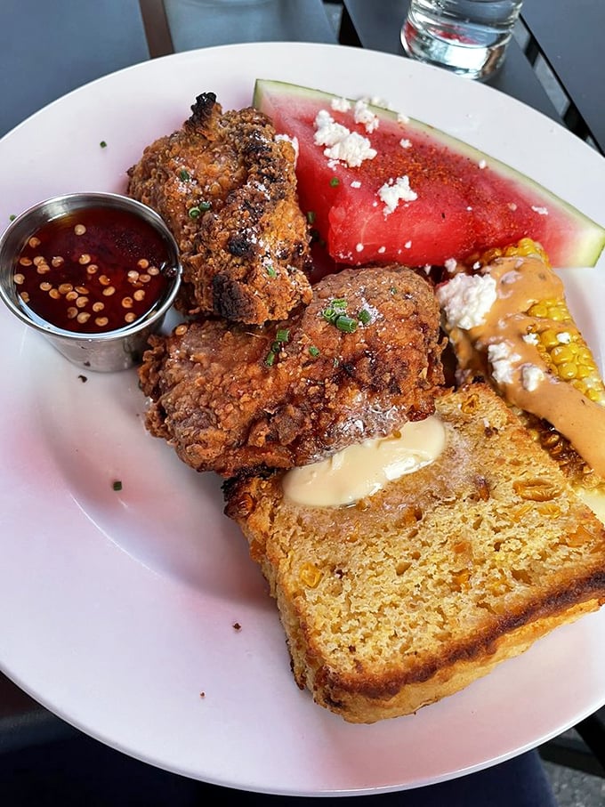 Golden-brown fried chicken that shatters with each bite, paired with sweet corn bread. This plate doesn't just speak to your stomach&mdash;it serenades it.