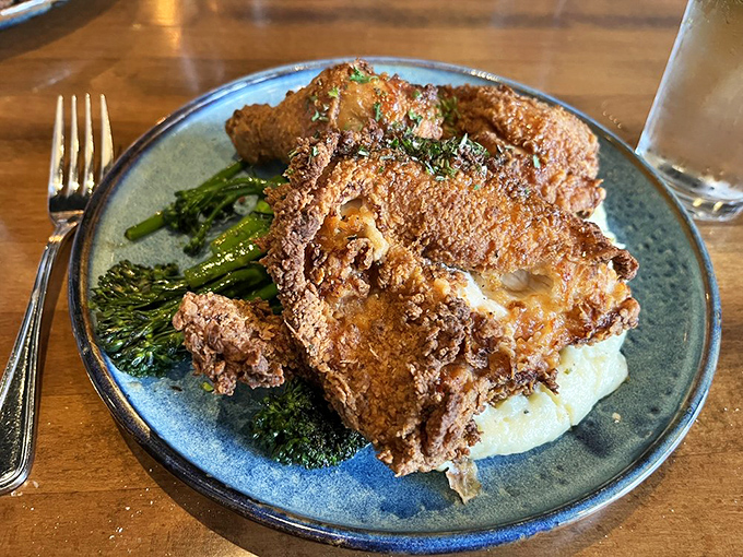 Golden, crackling perfection atop a cloud of mashed potatoes. This fried chicken doesn't just speak to your soul&mdash;it sings a full gospel choir.