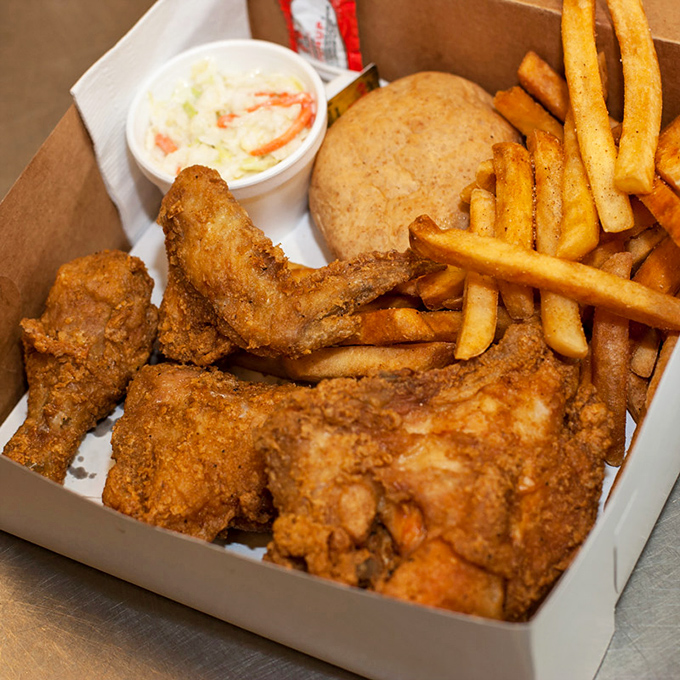 Golden-brown fried chicken nestled against crispy fries and creamy slaw &ndash; a holy trinity of comfort that makes time stand still.