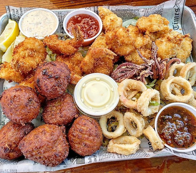 A seafood festival on newspaper&mdash;where conch fritters, fried shrimp, and calamari gather like old friends celebrating the bounty of the sea.
