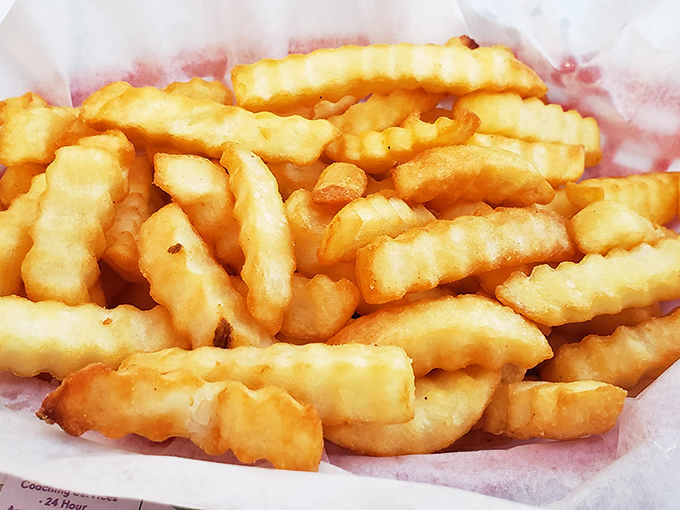 Golden, crispy, crinkle-cut perfection. These aren't just french fries; they're edible treasure that would make potato farmers weep with pride.