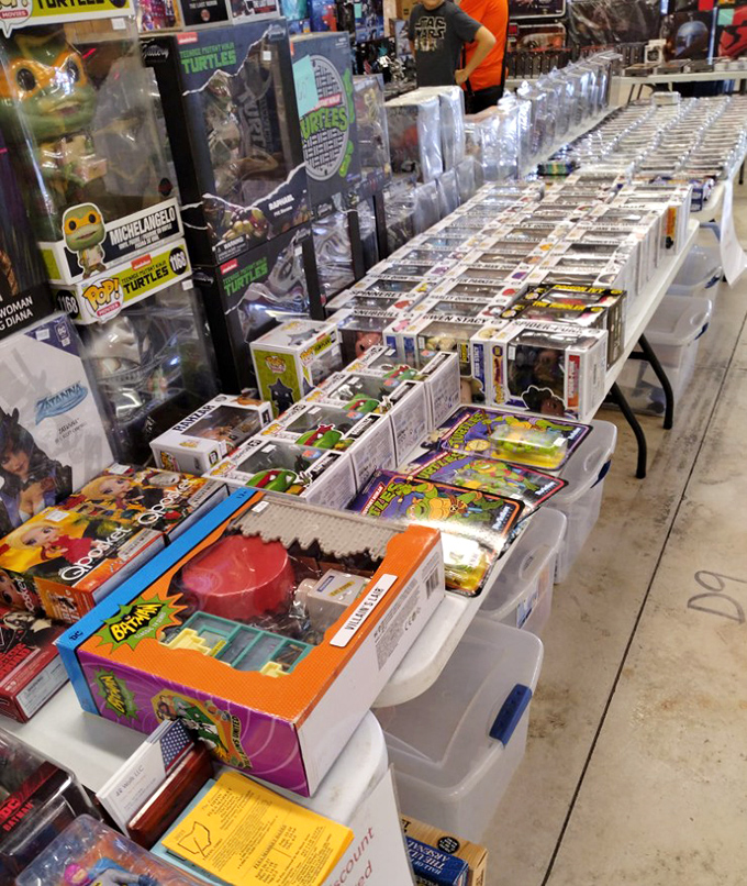 Pop culture paradise! Collectors examine rows of boxed figurines, each tiny character representing someone's childhood memories or current obsession.