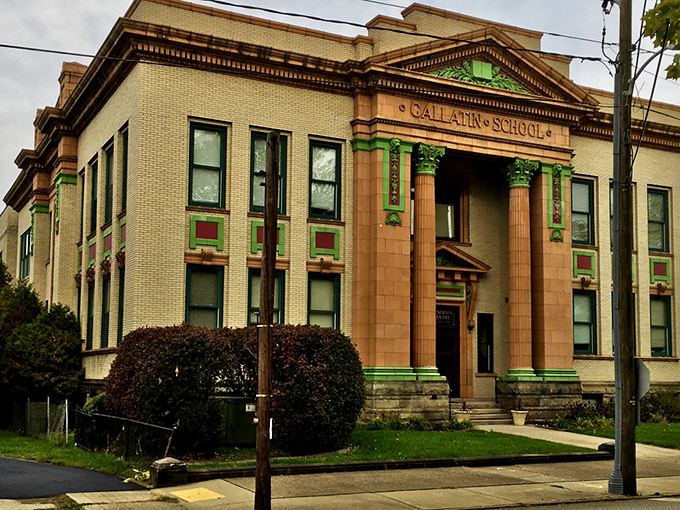 Gallatin School stands as a testament to when educational buildings were architectural statements. Those green accents against yellow brick? Pure early 20th-century swagger.