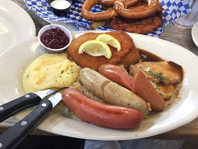 A plate that answers the eternal question: "Why choose one German specialty when you can have them all?" Schnitzel, sausages, and sides living in delicious harmony.