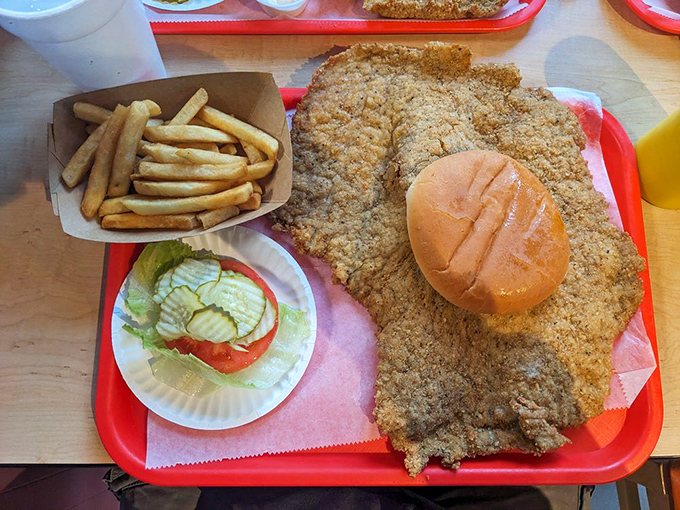 The legendary tenderloin in its natural habitat &ndash; a sandwich so massive it makes the plate look like a coaster. Bun for scale!