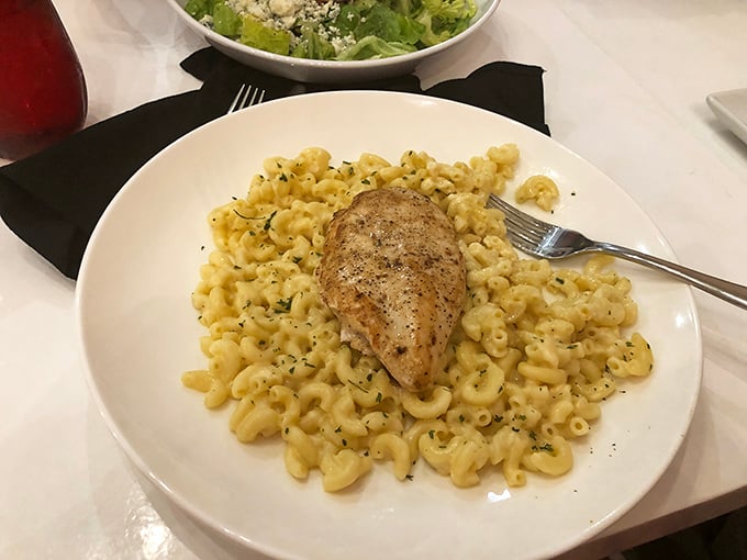 Mac and cheese transcends to art form here&mdash;perfectly al dente pasta swimming in creamy goodness, topped with herb-seasoned chicken that's begging for your attention.