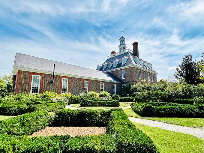 The Governor's Palace stands regally amid meticulously manicured hedges—the 18th-century equivalent of saying "my topiary game is stronger than yours."