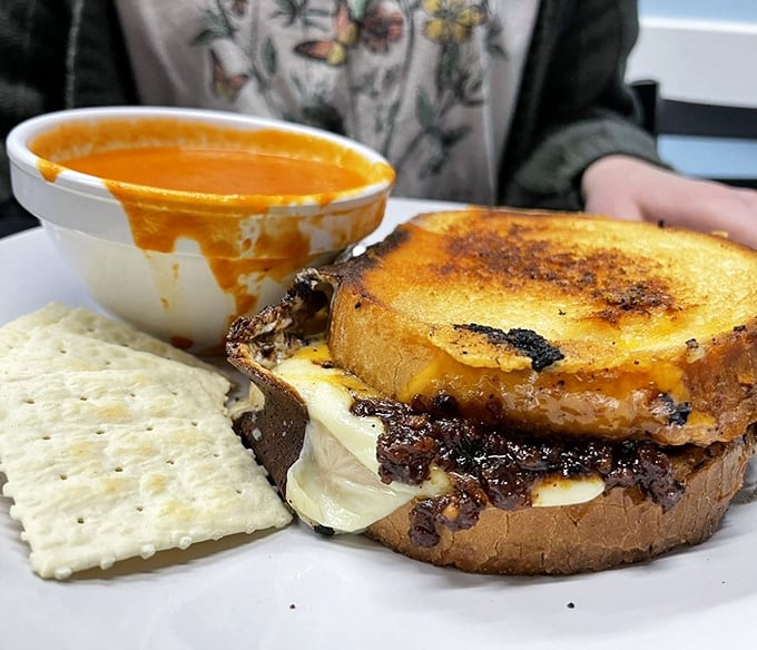 This isn't just melted cheese on bread&mdash;it's a childhood memory transformed into adult indulgence, complete with soul-warming tomato soup for dunking.