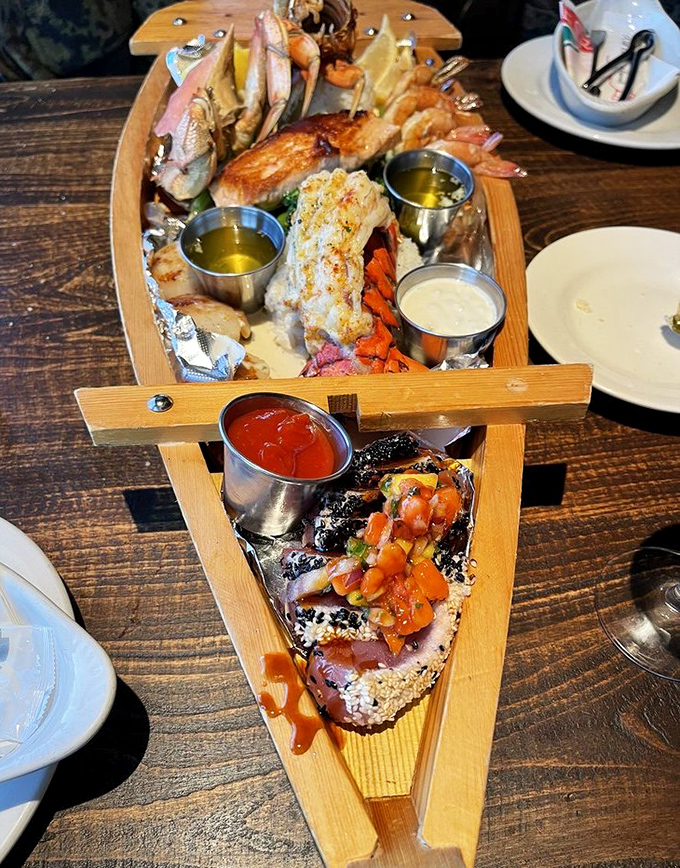 The Grotto Seafood Sampler isn't just a plate&mdash;it's a wooden boat carrying precious cargo of perfectly prepared ocean treasures and dipping sauces.