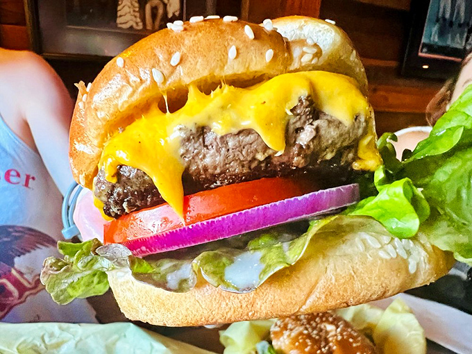 This half-pound masterpiece isn't just a burger&mdash;it's edible poetry. The melted cheese cascades over the patty like a yellow waterfall of deliciousness.