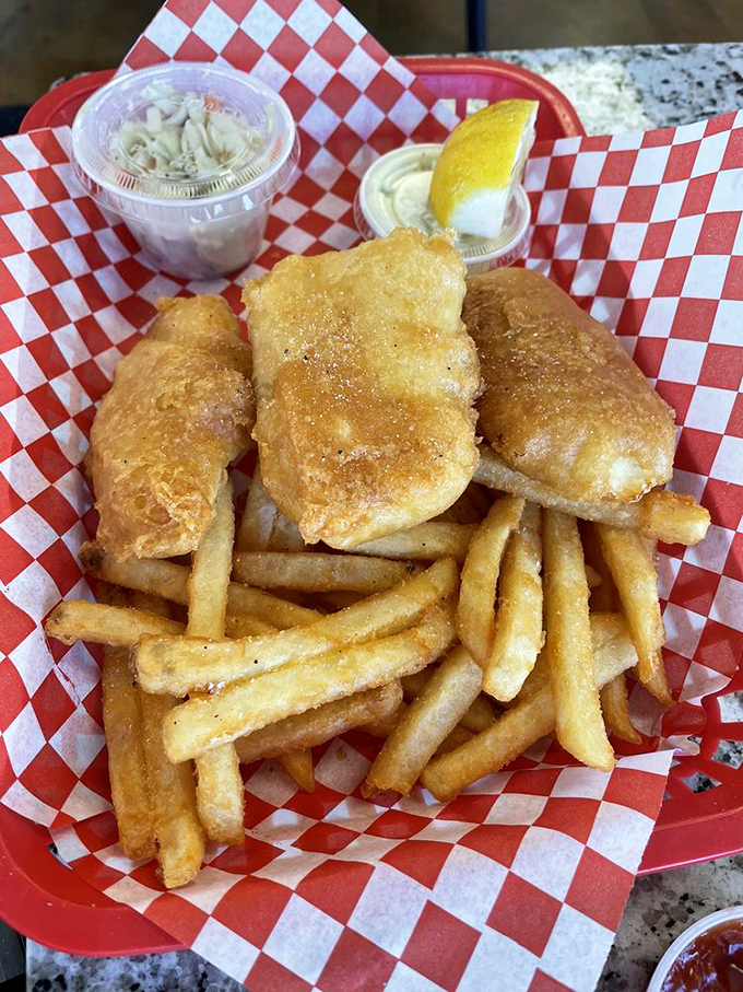 Golden-battered halibut that shatters with each bite, paired with fries that could make a Frenchman weep. This is coastal Oregon on a red basket.