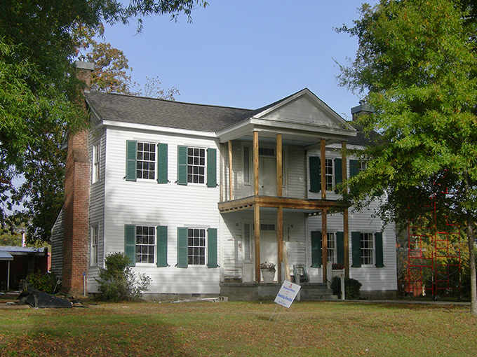 This historic home stands as elegant proof that Southern architecture doesn't need McMansion square footage to make a statement.