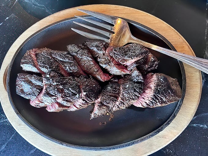 Perfectly sliced hanger steak showcasing the kind of precision that separates good restaurants from unforgettable ones.