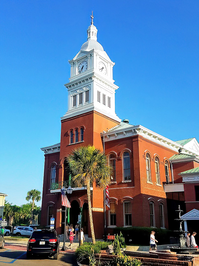 The historic Nassau County Courthouse stands proud with its gleaming clock tower, keeping time for the town since long before digital watches ruined our attention spans.