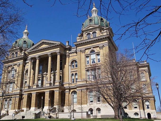 The Iowa State Capitol's golden dome gleams in the sunshine, proving that sometimes government buildings can be downright gorgeous.