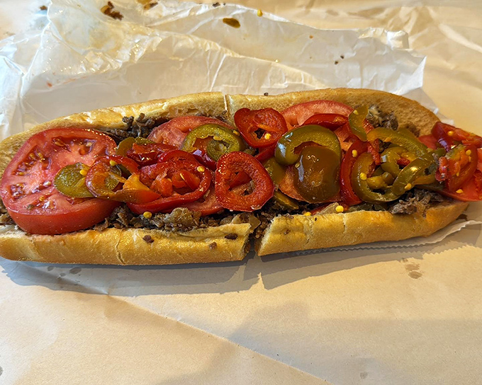 This isn't just lunch&mdash;it's an Italian beef masterpiece with vibrant tomatoes and peppers creating a harmony of flavors that sings with every bite.