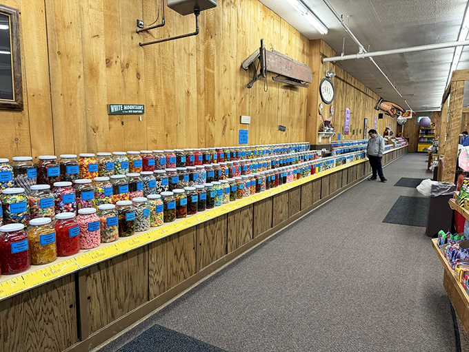 The Great Wall of Candy Jars stands at attention, each glass soldier protecting its sweet treasure until you arrive with your paper bag.