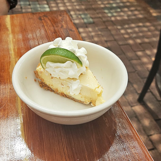 The legendary Key lime pie arrives like Florida sunshine on a plate&mdash;tart, sweet, and topped with a lime slice that's not just for show.