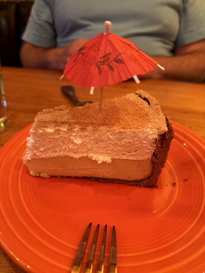 This isn't just Key Lime Pie—it's a slice of tropical vacation topped with a tiny paper umbrella. Tangy, sweet, and worth saving room for.