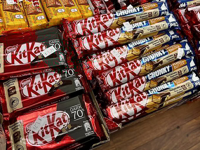 Kit Kat paradise where fingers are never broken, just arranged in a mouthwatering display of international chocolate-wafer diplomacy.