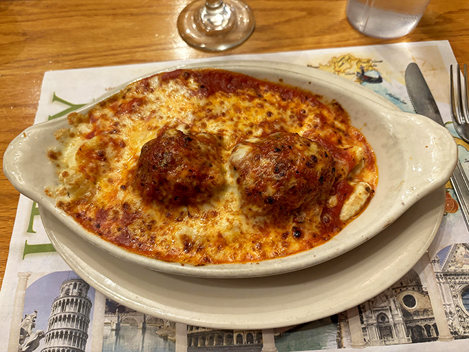 These meatballs aren't just sitting on cheese&mdash;they're lounging on a bubbling hot tub of marinara and mozzarella like they own the place.