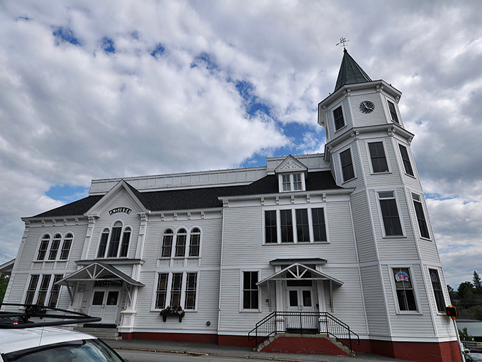 The town building stands like a proud parent watching over Main Street, its white tower a beacon of civic pride that's visible from nearly anywhere in town.