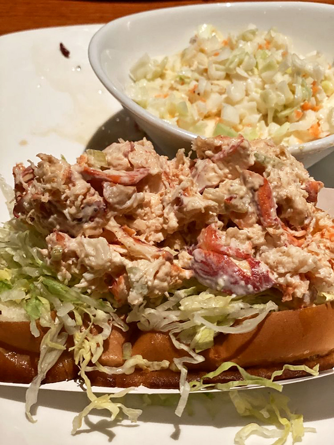 This lobster roll doesn't play hard to get – it's all meat, minimal filler. That creamy slaw on the side isn't just playing backup; it's a star in its own right.