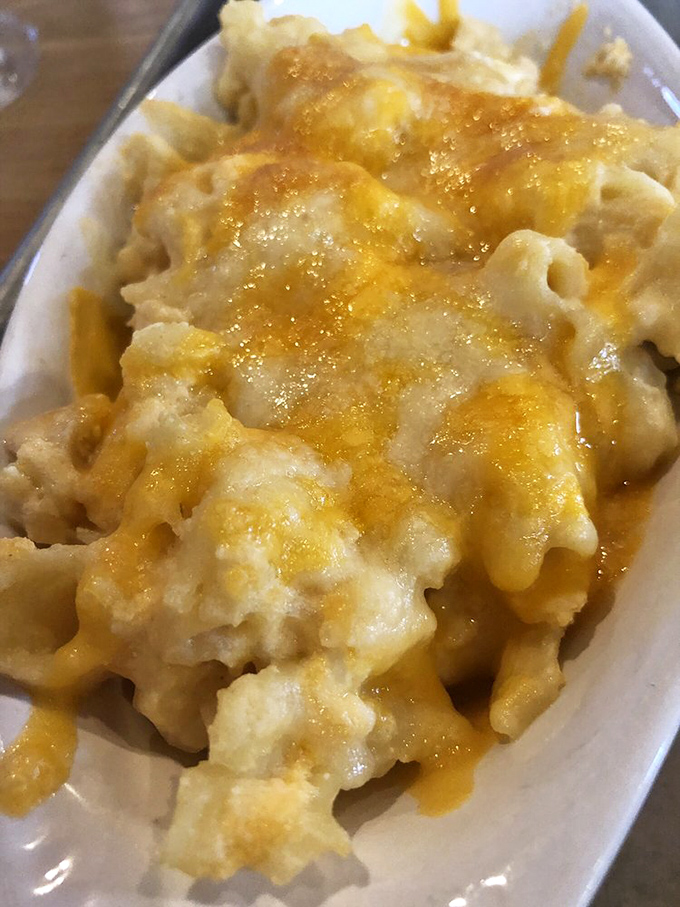 The mac and cheese that launched a thousand road trips—molten, creamy perfection that makes grown adults close their eyes in silent reverence.