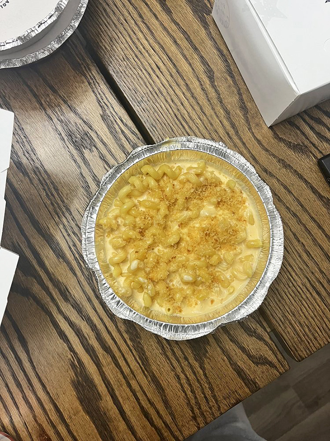 Mac and cheese that deserves its own Instagram account. That golden crust is nature's way of telling you happiness is just one fork-dive away.