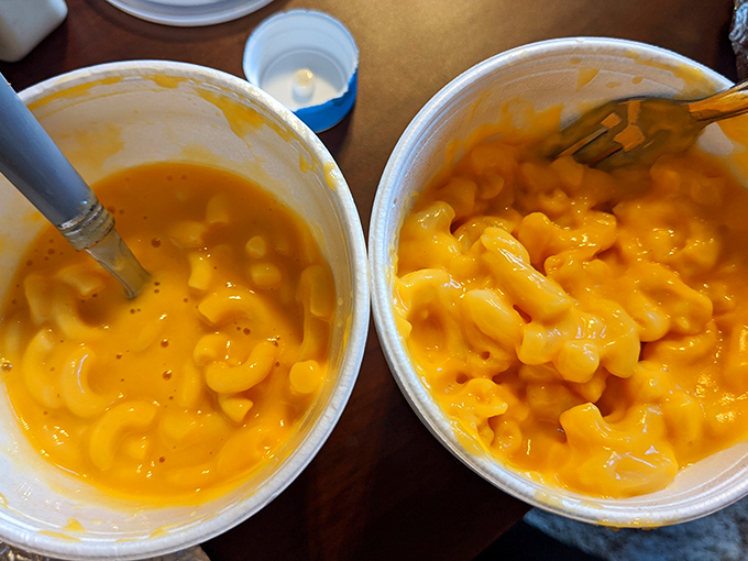 Mac and cheese so gloriously orange it could signal aircraft. This isn't artisanal or farm-to-table—it's just plain better-than-your-childhood.