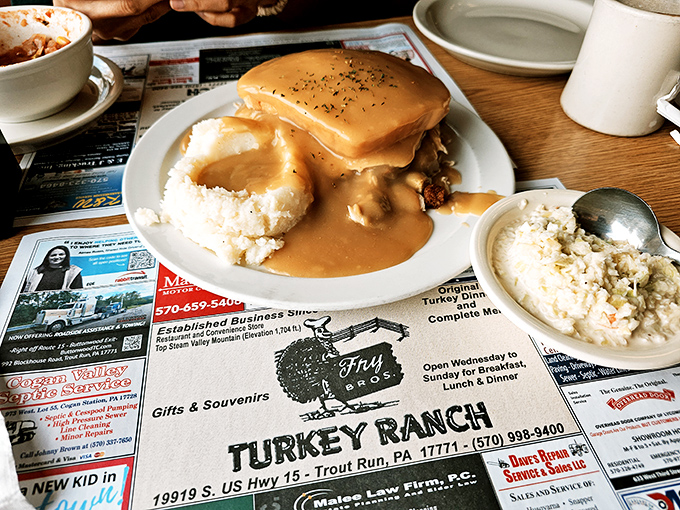 That gravy river flowing over cloud-like mashed potatoes and turkey might just be what heaven looks like to comfort food enthusiasts.