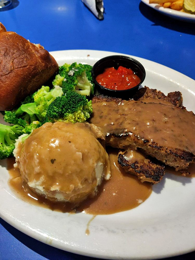Meatloaf that doesn't just remind you of home&mdash;it makes you question why you ever left. That gravy river deserves its own zip code.