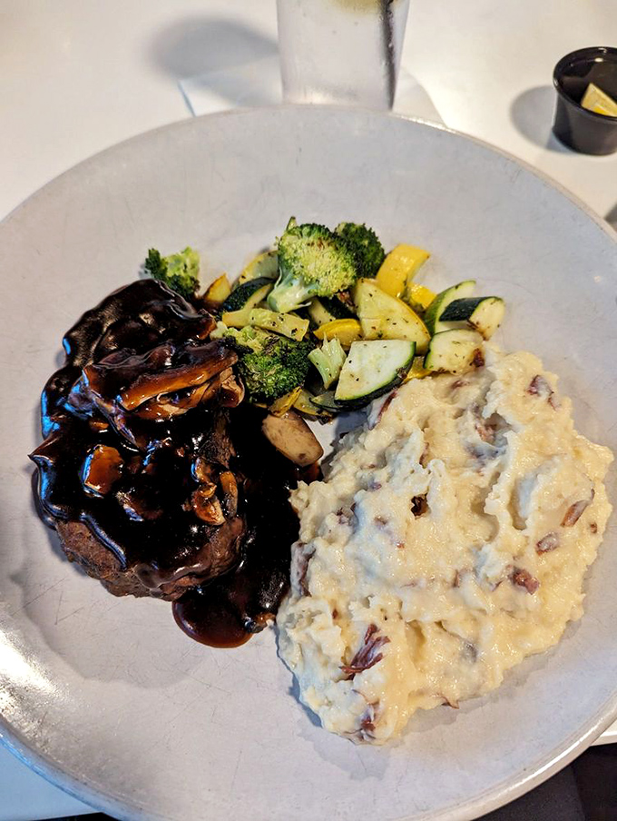 Behold the star of the show! This meatloaf, glazed to perfection, makes a compelling case for driving across county lines.