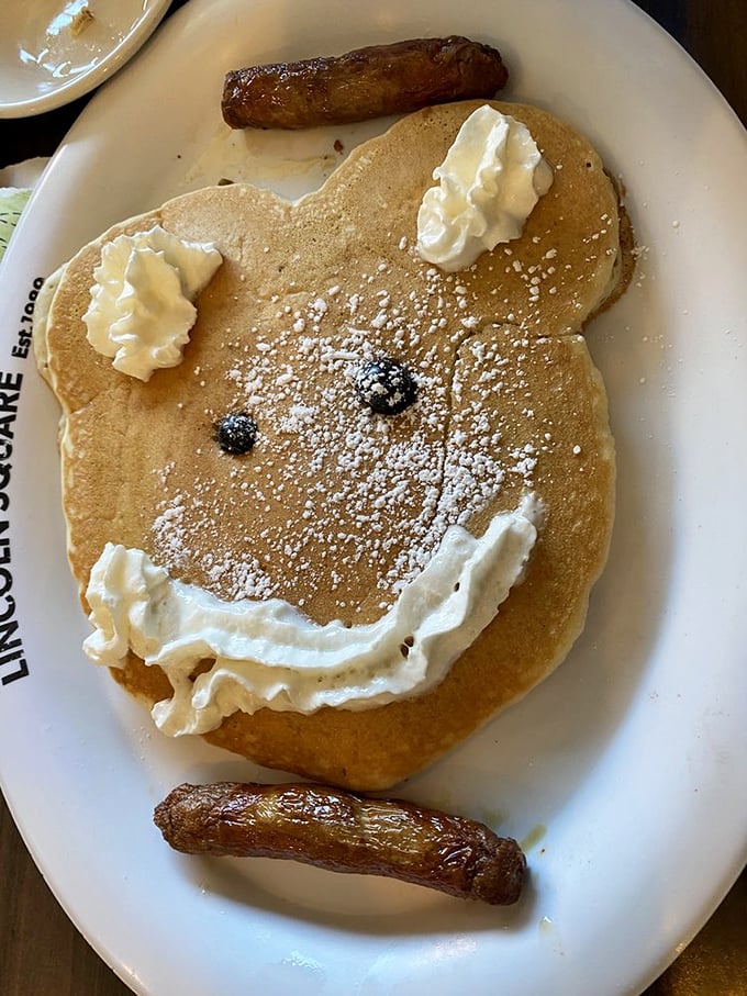 Who says you can't play with your food? This Mickey-inspired pancake comes with a side of childhood nostalgia and two perfectly cooked sausage links.