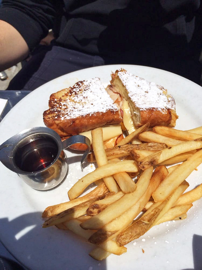 The Monte Cristo: where French toast, ham, and melty cheese have their most delicious group hug. Powdered sugar snowfall included.