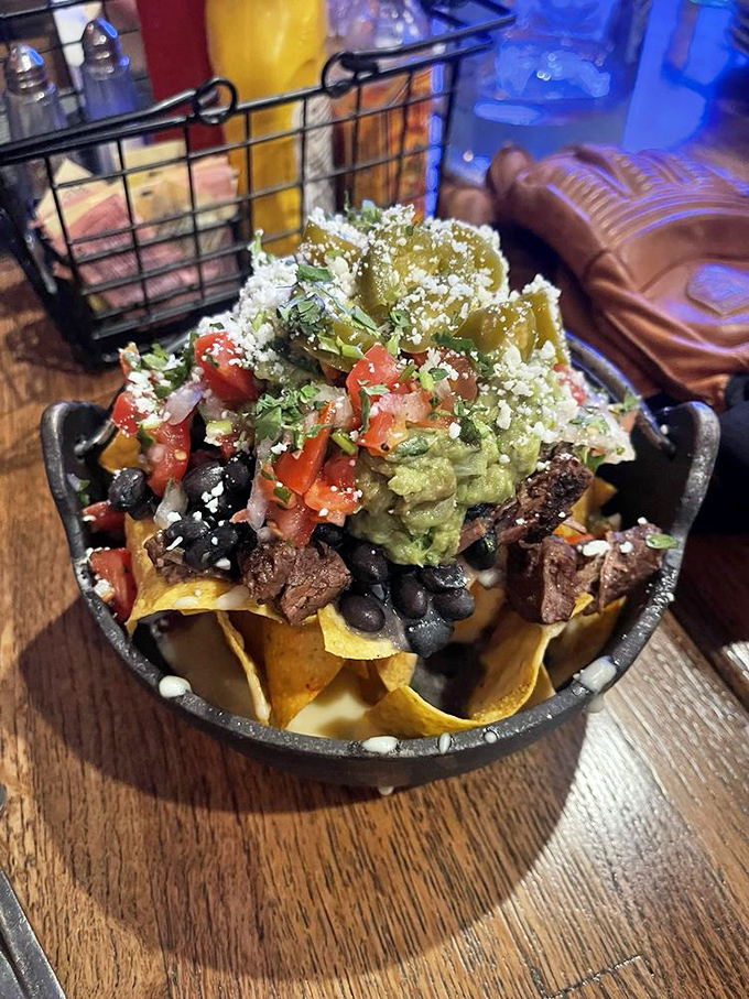 Nacho architecture at its finest&mdash;layers of chips supporting a mountain of toppings. This is structural engineering you can eat.