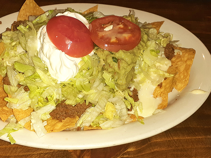 These nachos don't play by the rules &ndash; they're a mountain of lettuce, sour cream, and tomato atop crispy chips that refuse to get soggy.