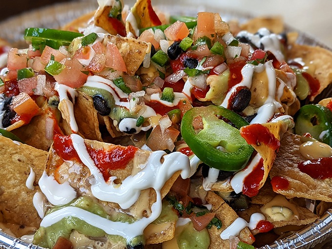Nacho architecture at its finest. Every chip bears the perfect ratio of toppings&mdash;no sad, naked tortillas lurking at the edges of this masterpiece.