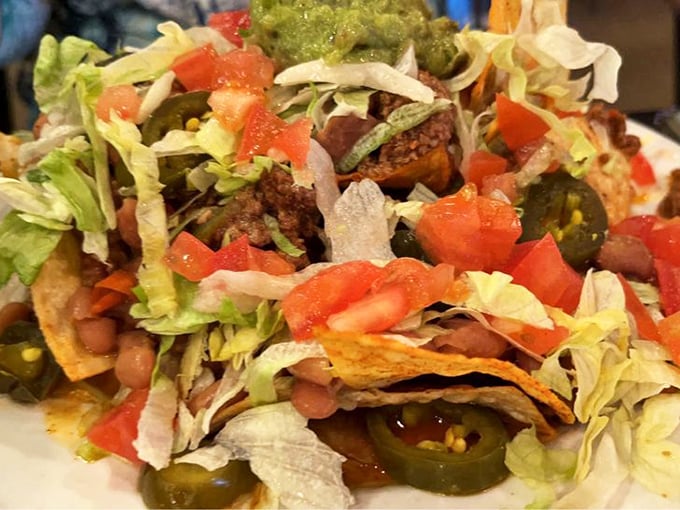 Mountain-high nachos that require a climbing strategy: start at the crispy base and work your way up through layers of flavor bliss.