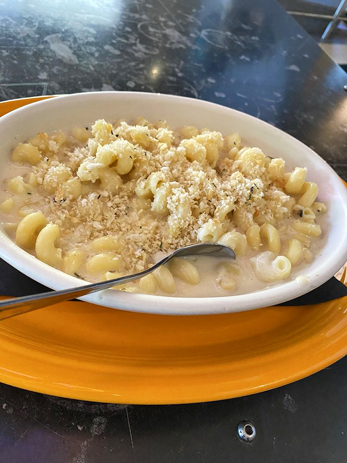 Behold, the star attraction: creamy mac and cheese crowned with a golden breadcrumb halo. This isn't just pasta&mdash;it's therapy in a bowl.
