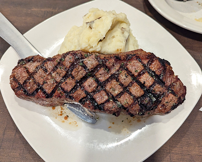 Behold the star of the show&mdash;a perfectly grilled New York Strip with textbook grill marks and a side of creamy mashed potatoes. Meat lovers, your prayers have been answered.