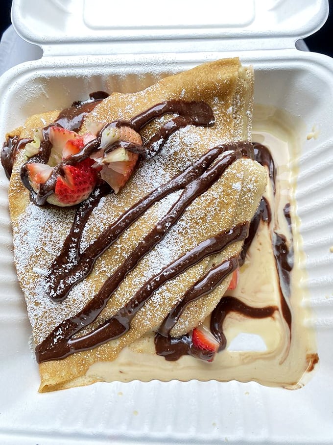 This Nutella crepe isn't just breakfast&mdash;it's an event. Fresh strawberries and chocolate drizzle make resistance futile.